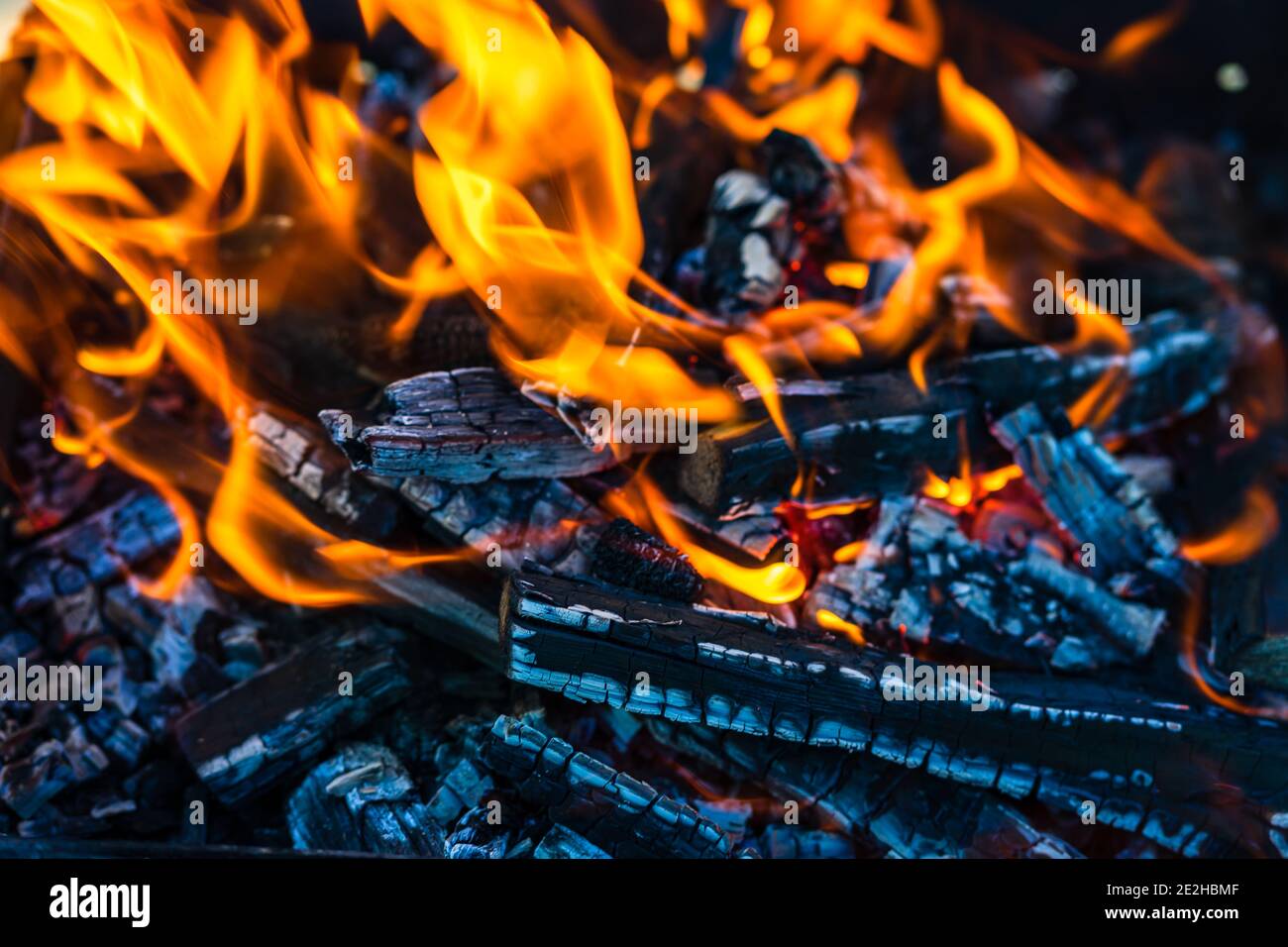 Burning wood chips to form coal. Barbecue preparation, fire before ...