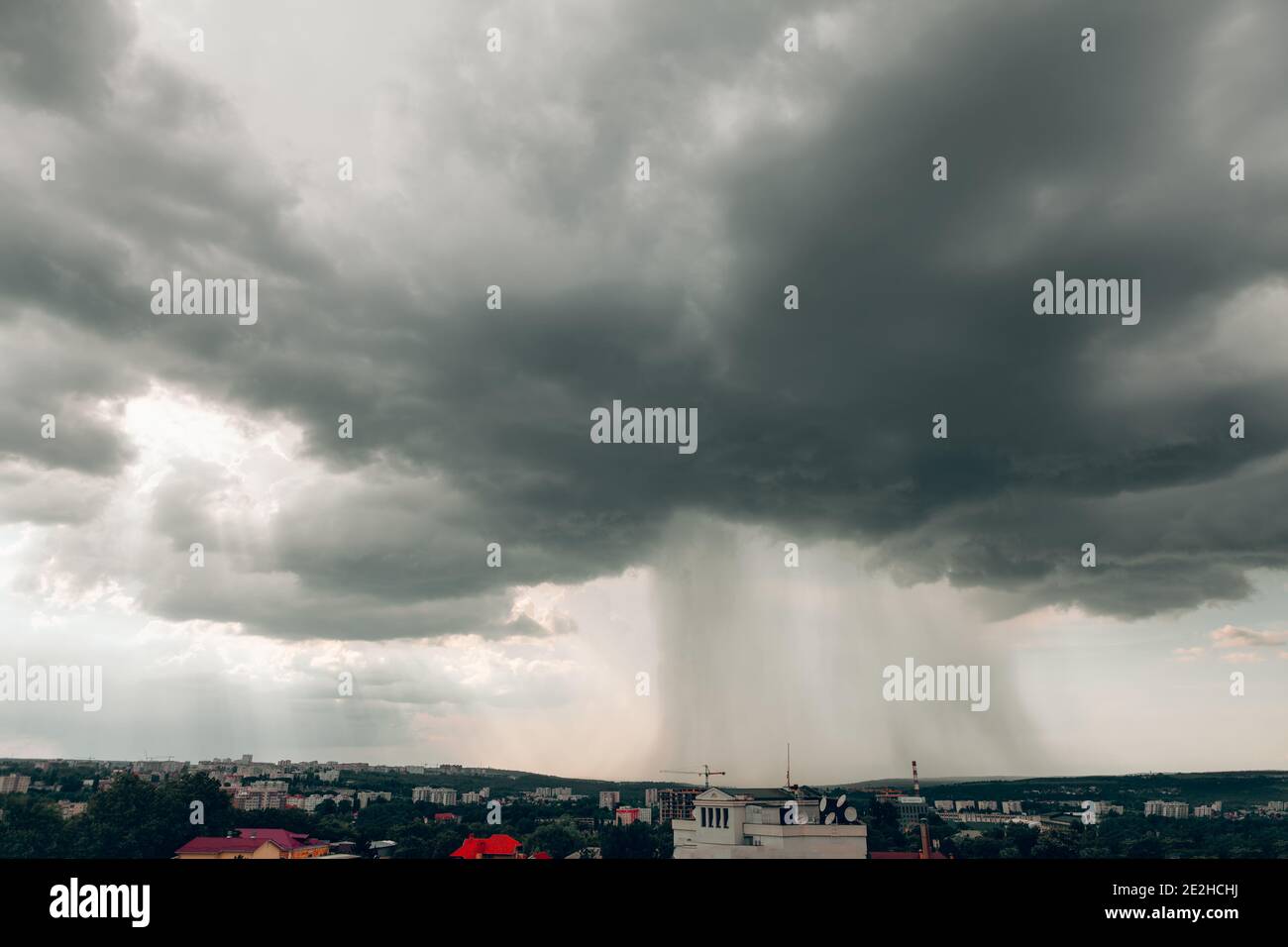 Heavy rain over the city . Rainy weather . Torrentian shower scenery ...