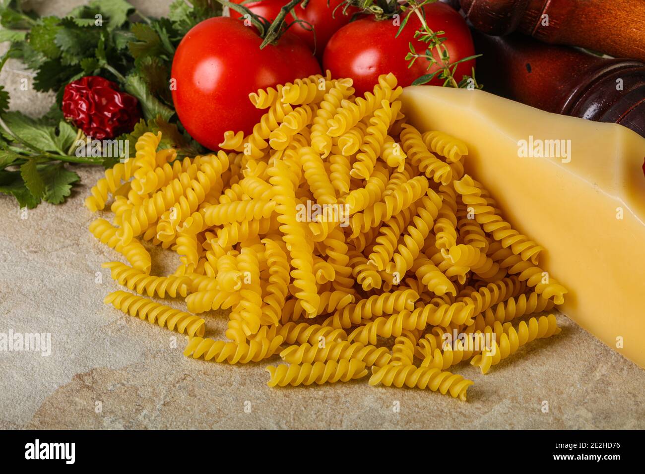Raw Italian pasta Fusilli for cooking with vegetables Stock Photo - Alamy