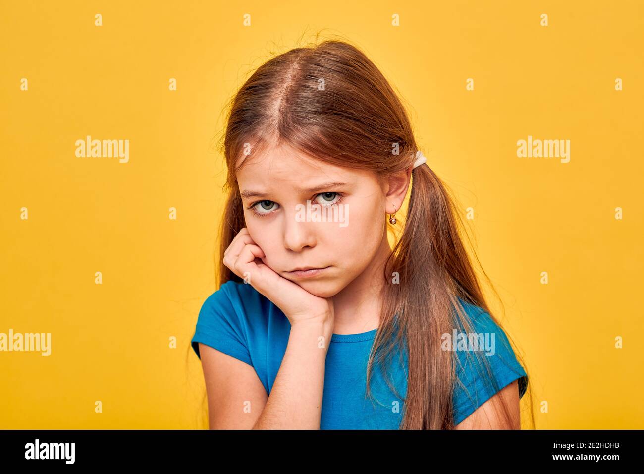 Beautiful girl has a toothache and she is very upset and holding her ...