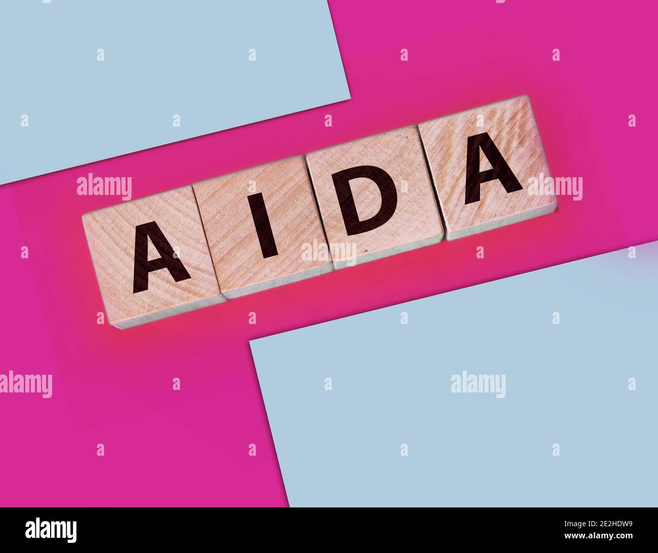 Four wooden cubes with letters AIDA meaning Attention Awareness ...