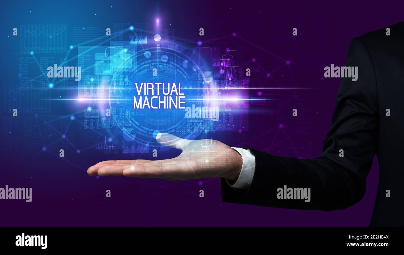 Man hand holding VIRTUAL MACHINE inscription, technology concept Stock ...