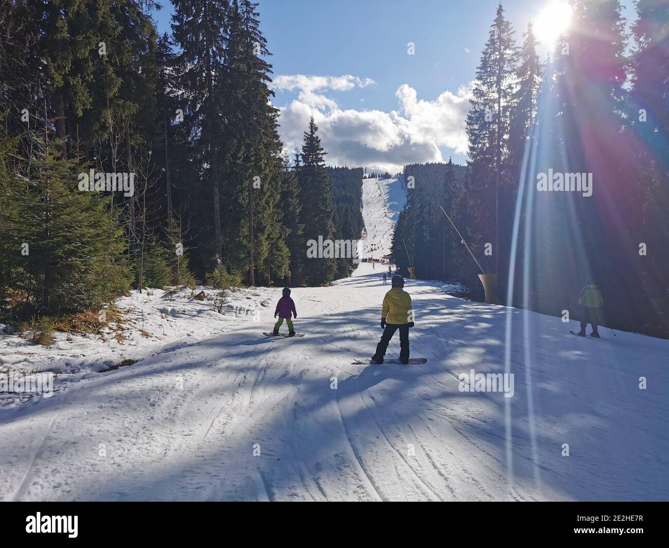 A group of people cross country skiing on a snow covered slope Stock ...