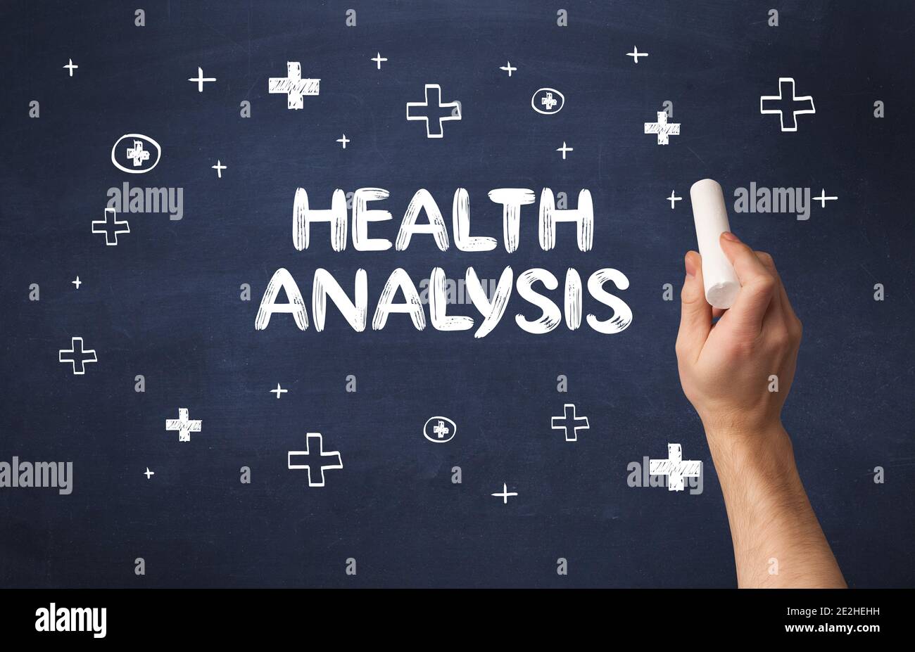 Hand drawing HEALTH ANALYSIS inscription with white chalk on blackboard ...