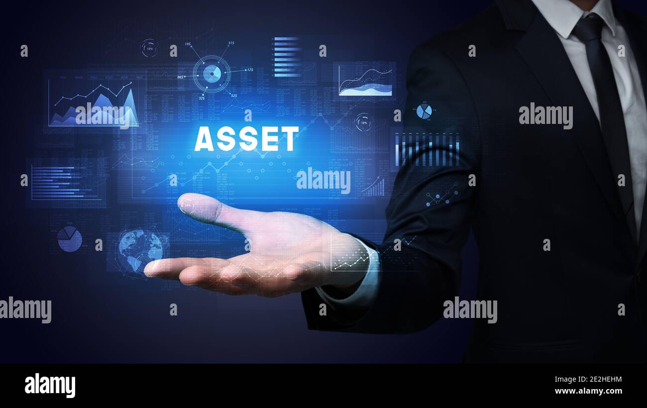 Hand of Businessman holding ASSET inscription, business success concept ...