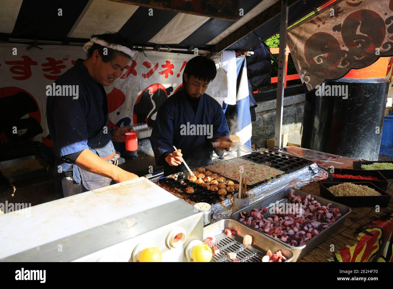 Kyoto,Japan, November 21 2014: hawker is ready the Takoyaki, octopus ...