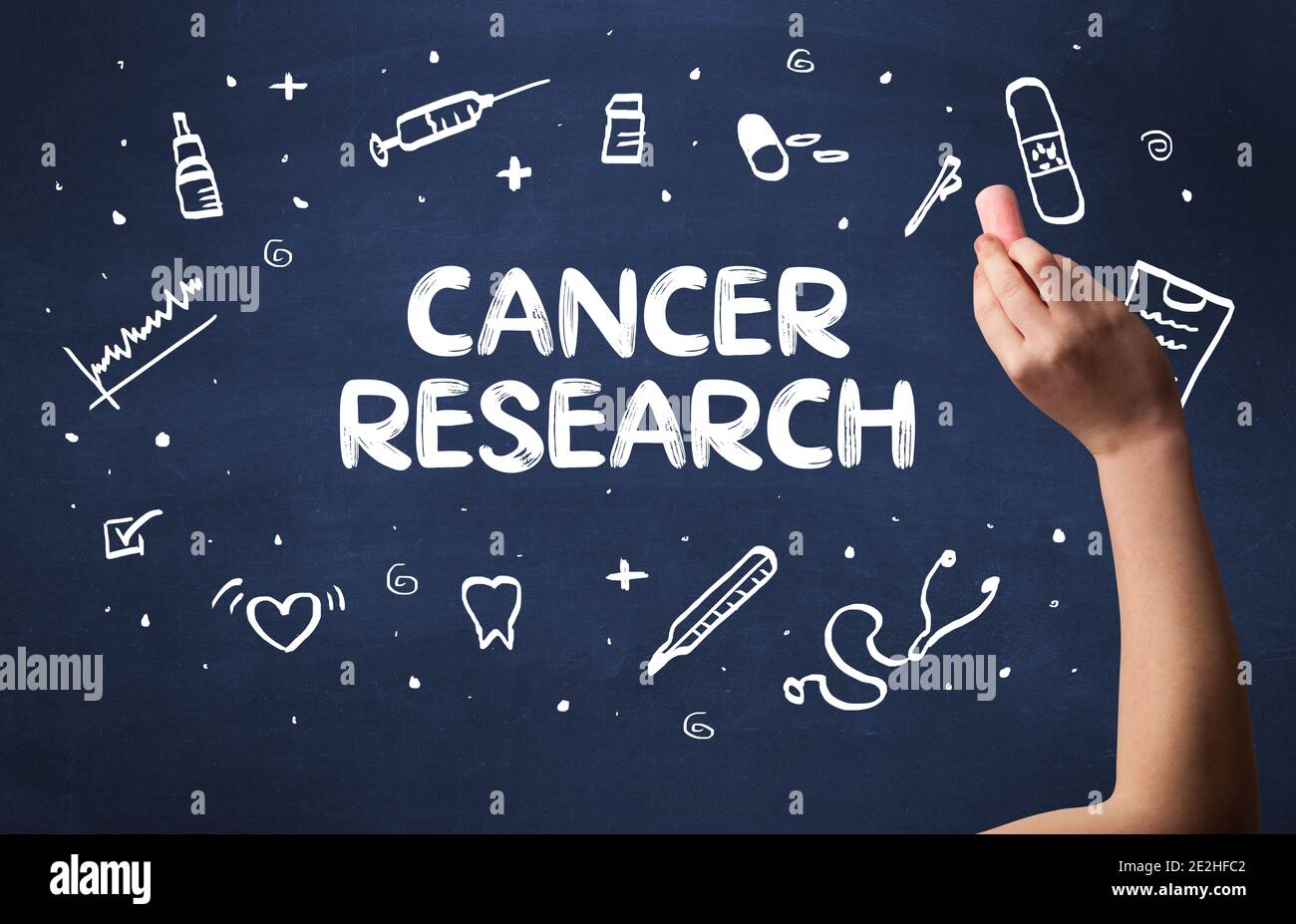 Hand drawing CANCER RESEARCH inscription with white chalk on blackboard ...