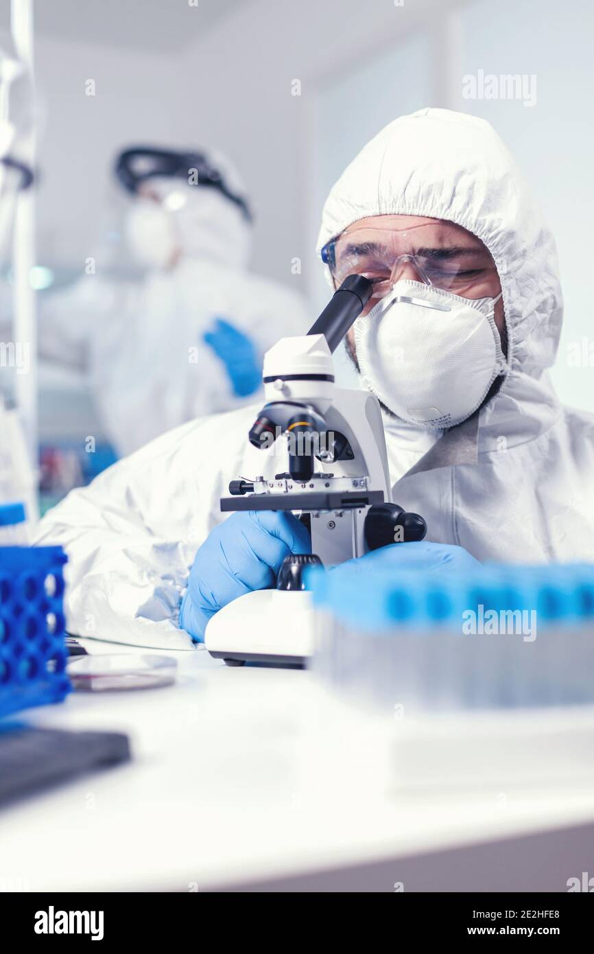 Laboratory researcher in protective coverall hi-res stock photography ...