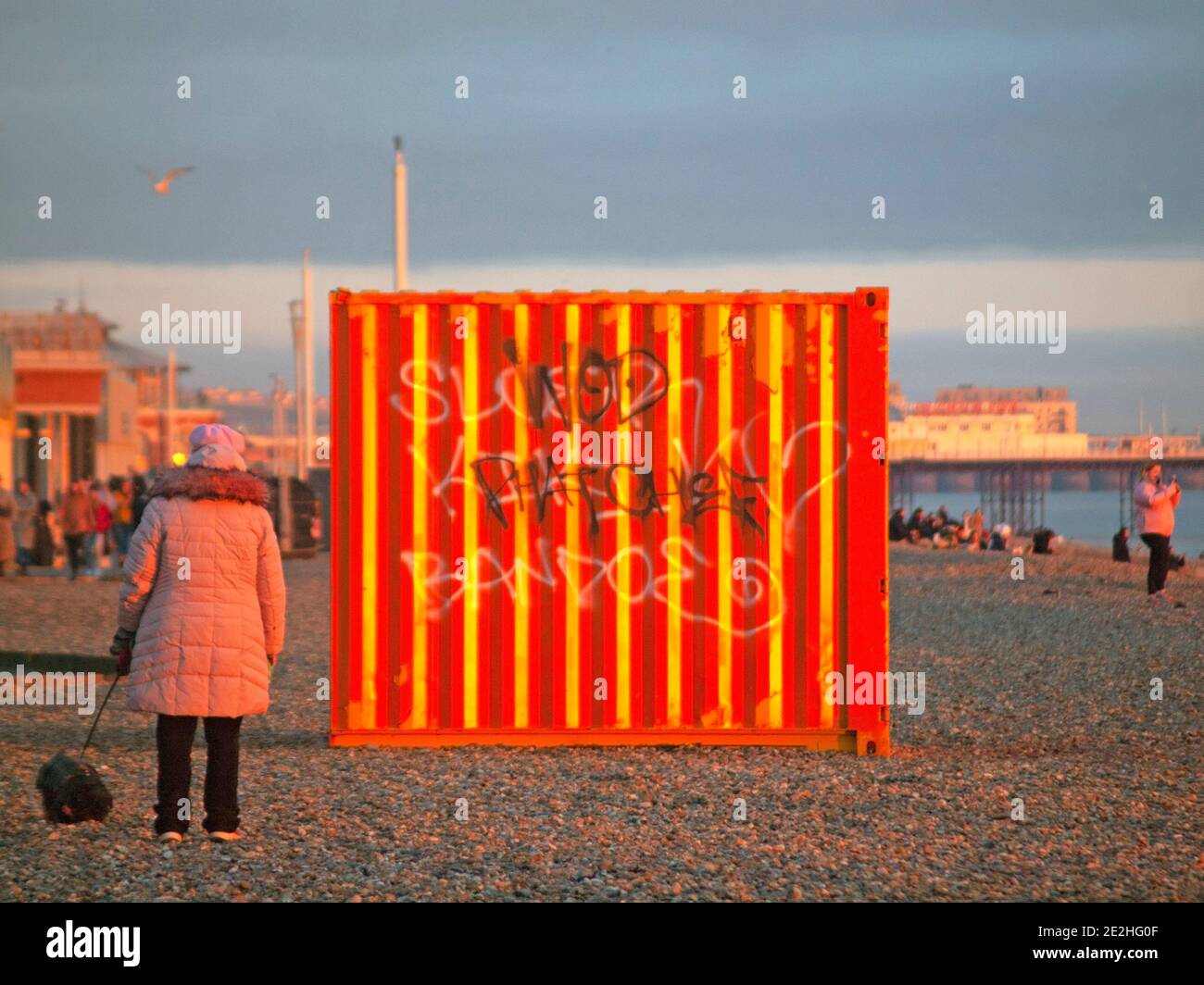 A brightly coloured shipping container on the beach at Brighton Stock ...