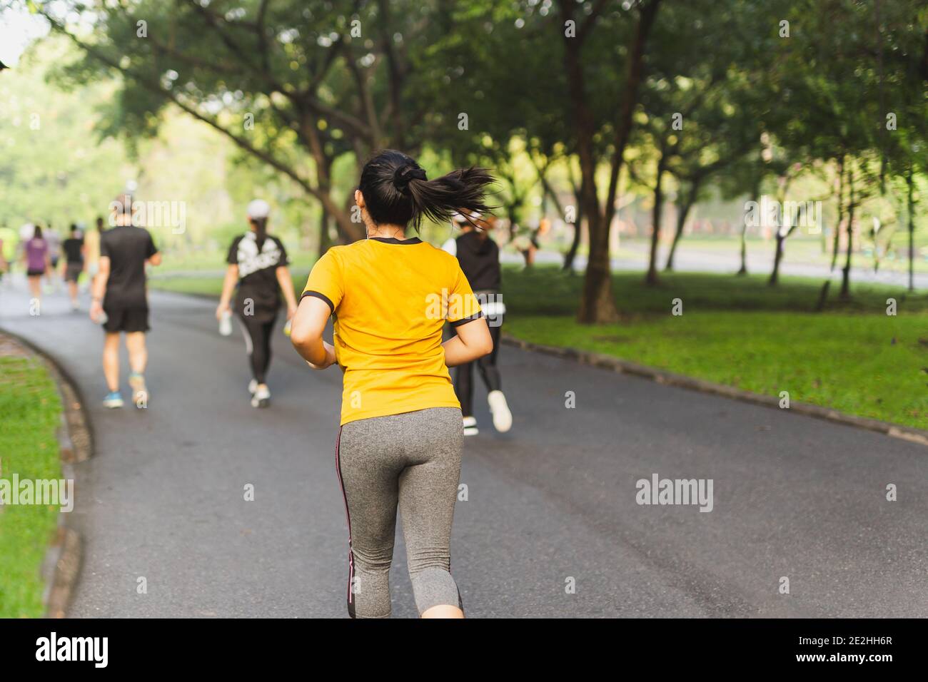 Healthy lifestyle group of active people running in the park Stock ...