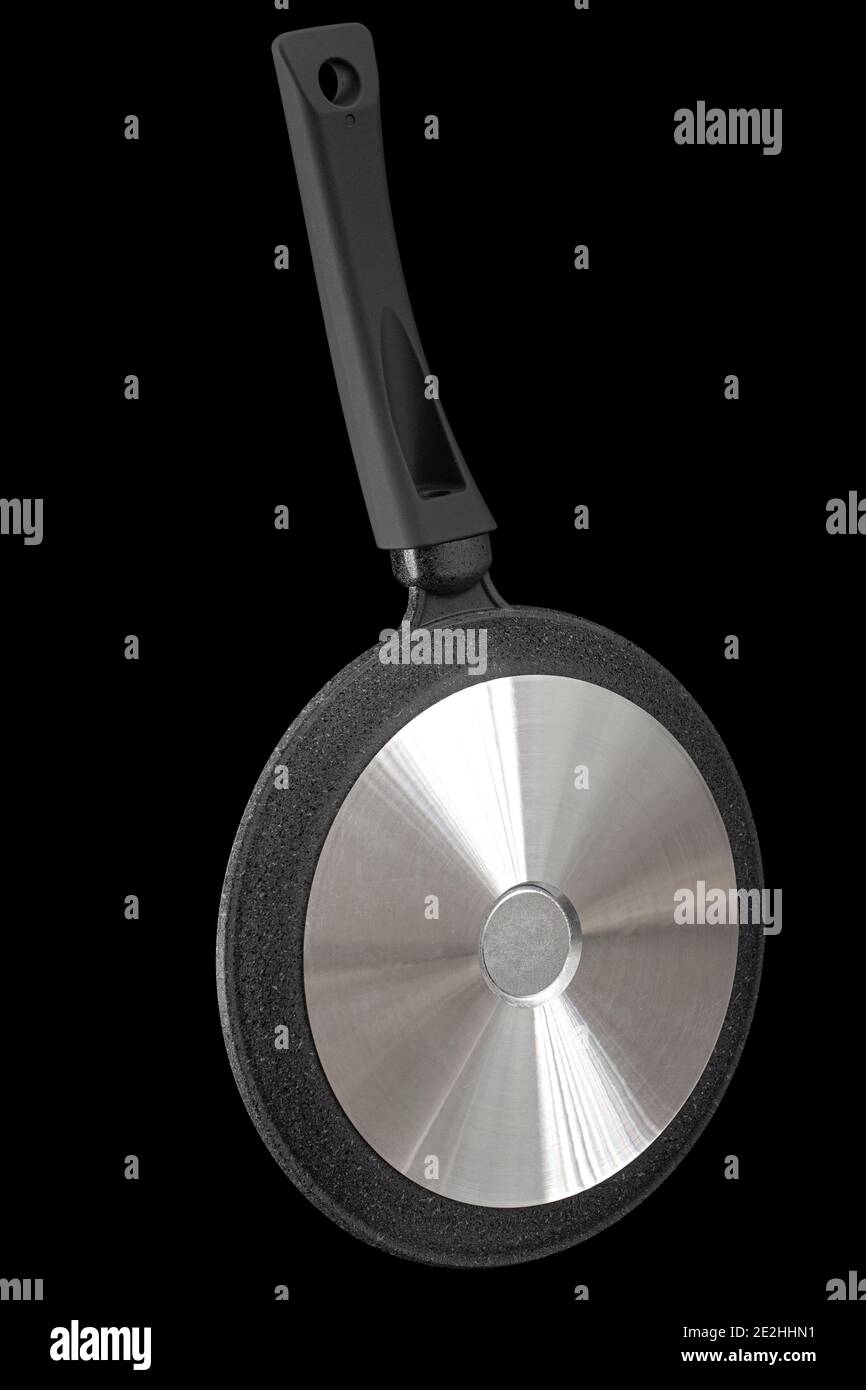 Grey frying pan with non-stick, rear view, isolated on black background ...