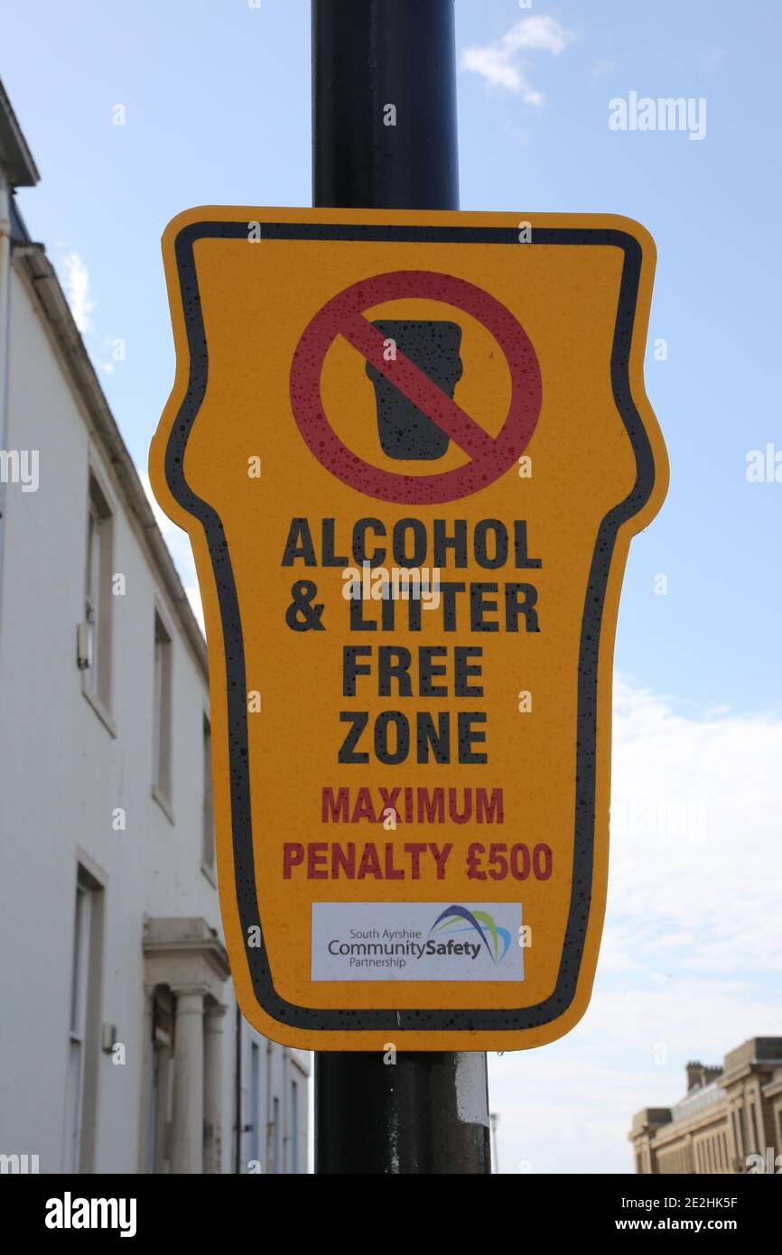 Warning sign on lampost, denoting an alcohol & litter free sign in the ...