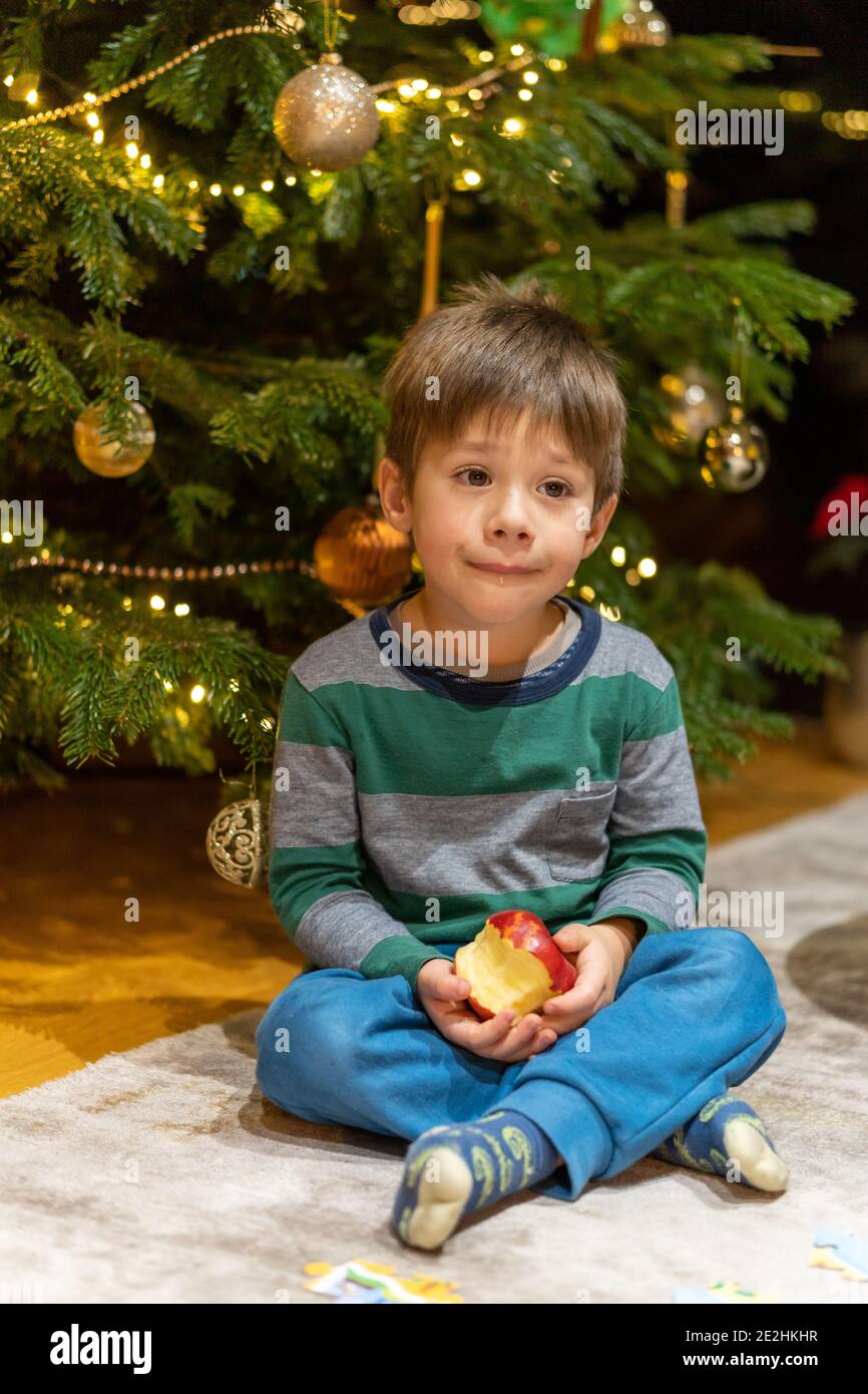 Boy under apple tree hi-res stock photography and images - Alamy
