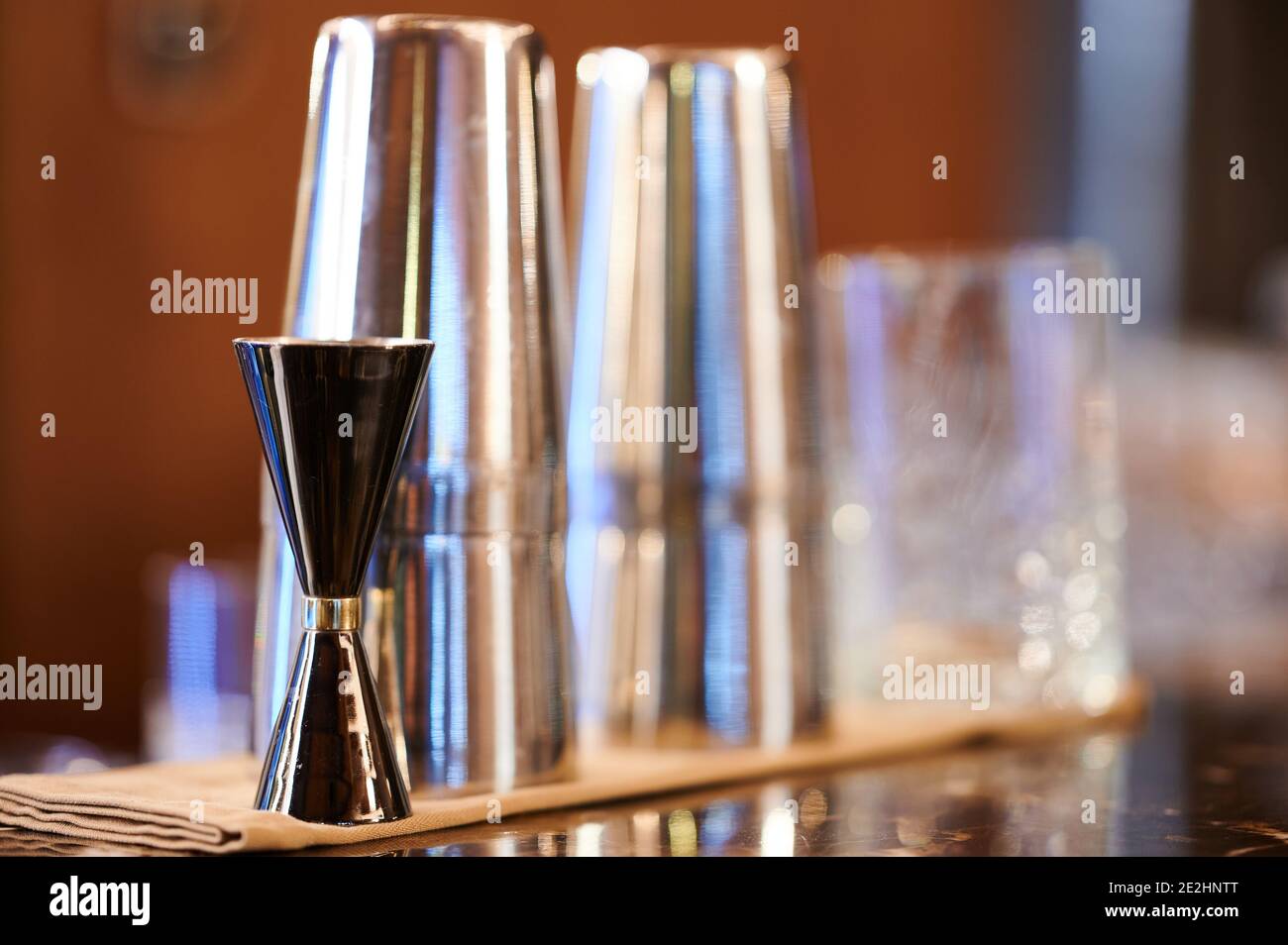 Measuring glass and cocktail shaker on the bar in the restaurant Stock ...