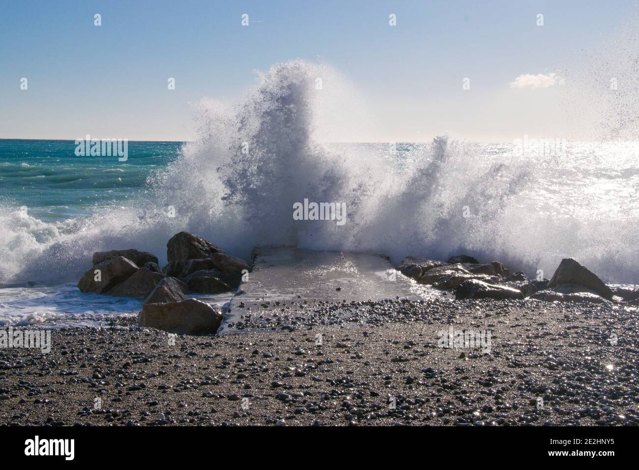 Waves splashing against rocks on a beach in Nice, South of France Stock ...