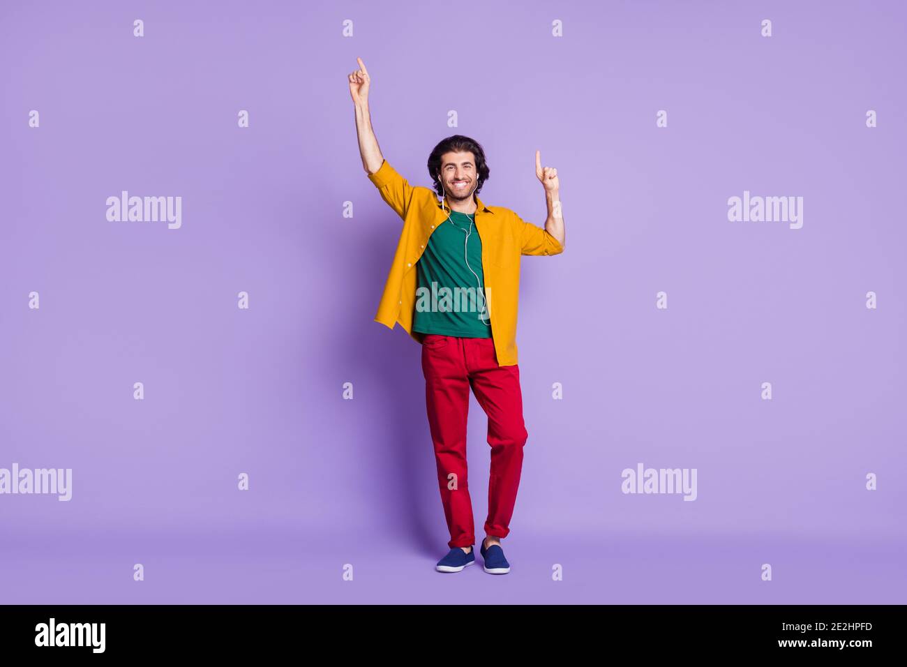 Full length photo portrait of man dancing pointing fingers up isolated ...