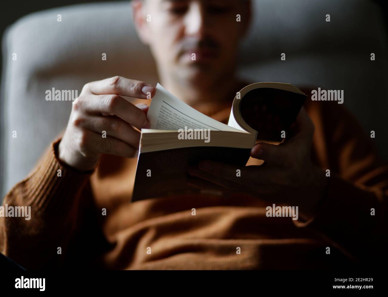 Man reading book hand and book closeup Stock Photo - Alamy
