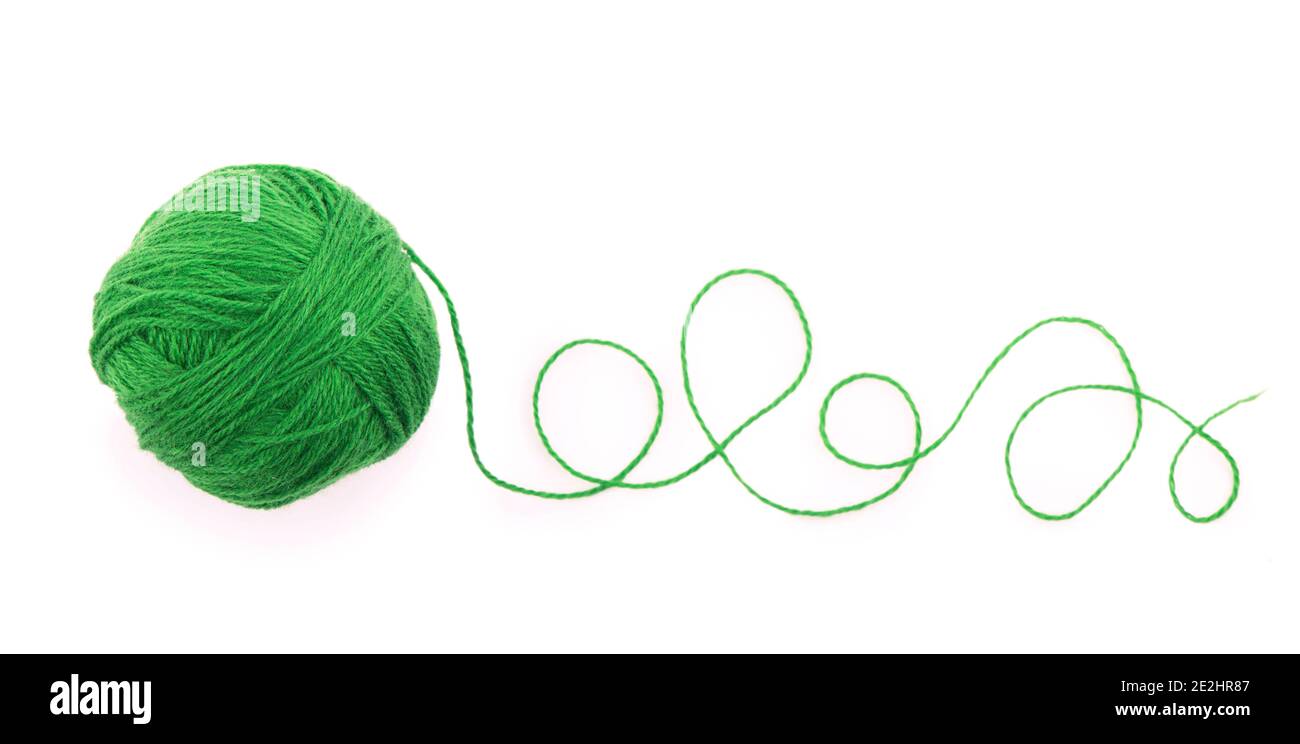 The idea is a tangled thread. Green ball of yarn on white background ...