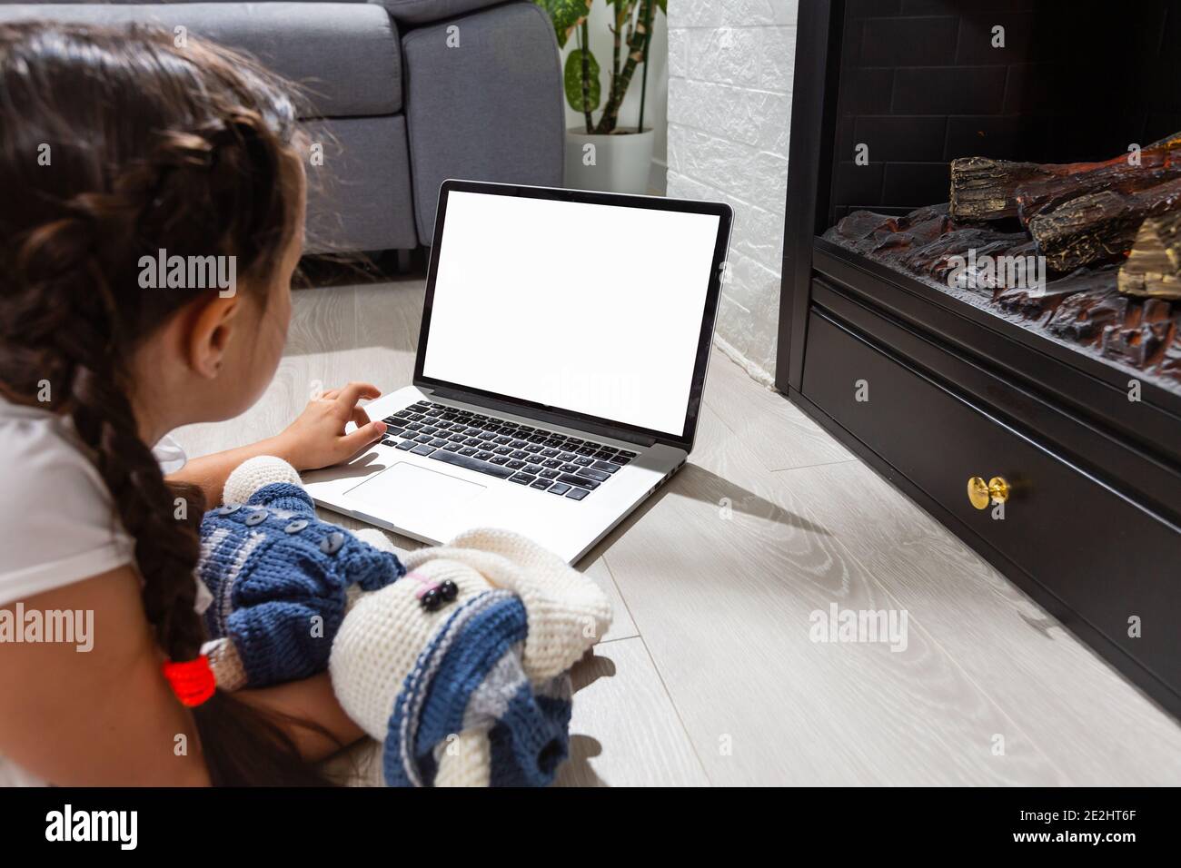 Kids distance learning. Cute little girl using laptop at home ...