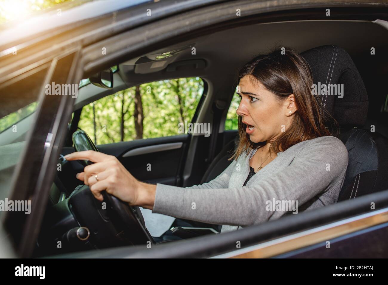 Caucasian female driver with a scared face during an accident Stock ...