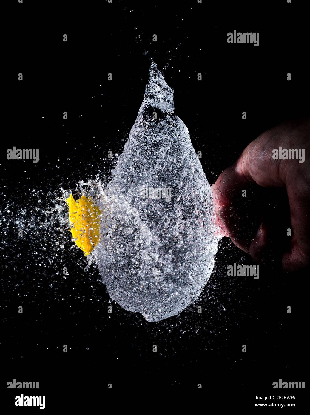 Closeup shot of a popped balloon full of water Stock Photo - Alamy