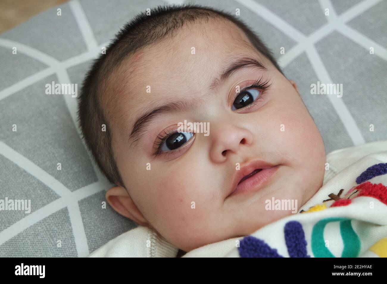 Baby girl with a lovely face, big eyes, and a cute face gesture Stock ...