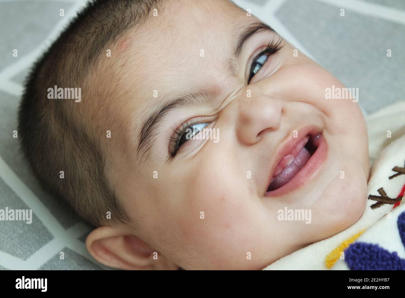 Baby girl with a lovely face, big eyes, and a cute face gesture Stock ...