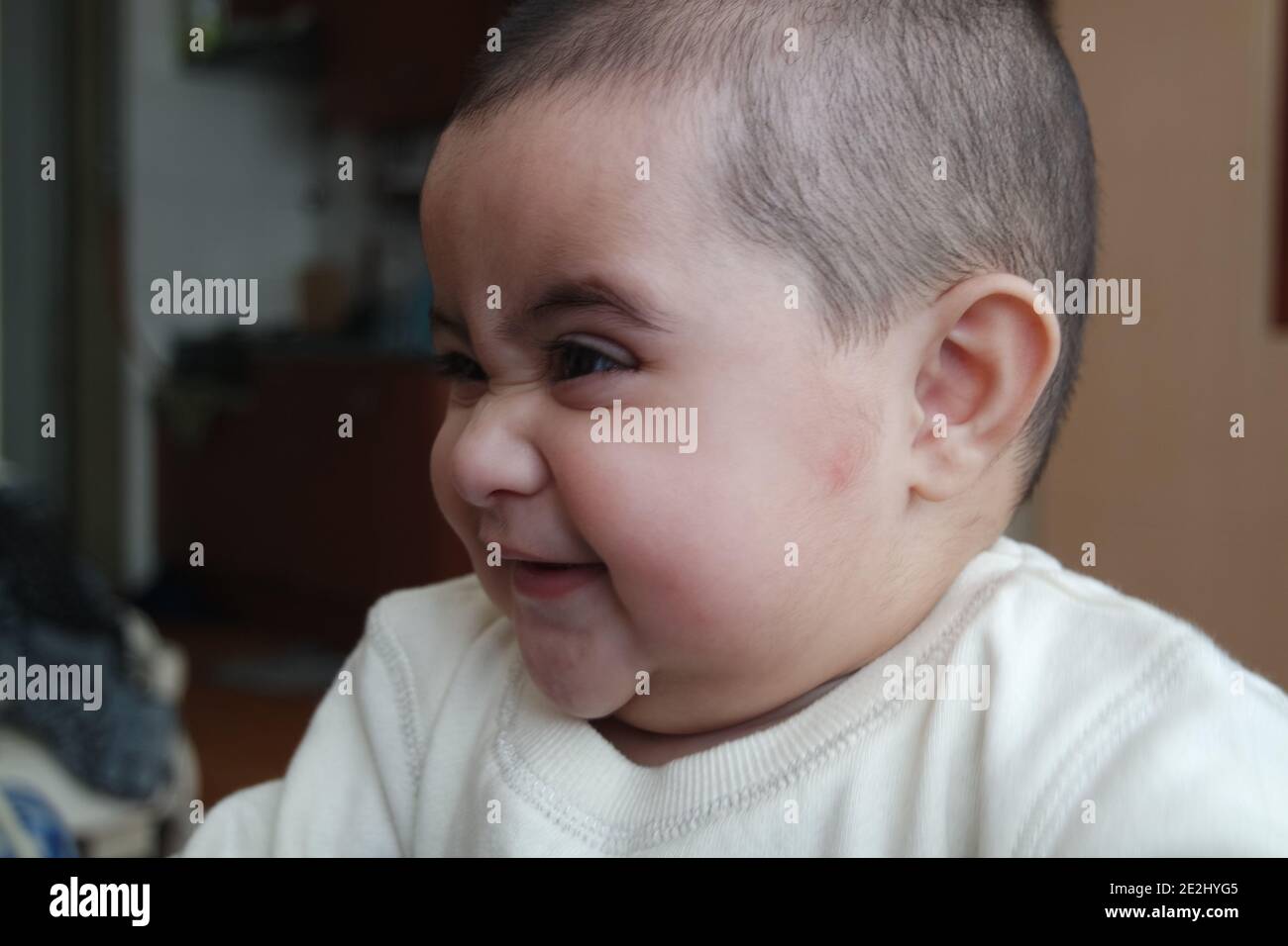 Baby girl with a lovely face, big eyes, and a cute face gesture Stock ...