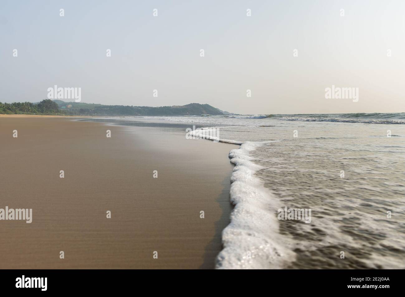 Low angle panoramic view of foamy sea waves of Arabian Sea swashing on ...