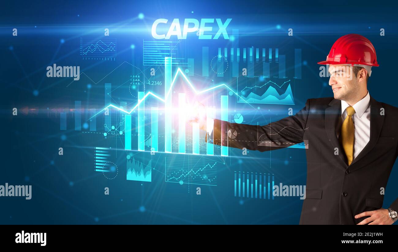 Handsome businessman with helmet drawing CAPEX inscription ...