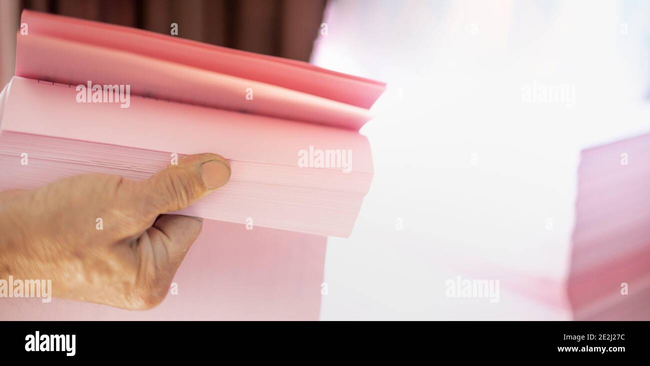 Male hand counting pile of paper preparing for letterpress machine and ...