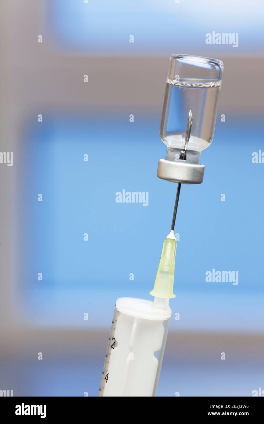 Vaccine syringe hi-res stock photography and images - Alamy