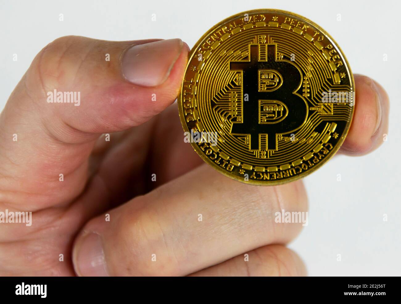 Coin holding human hand fingers hi-res stock photography and images - Alamy