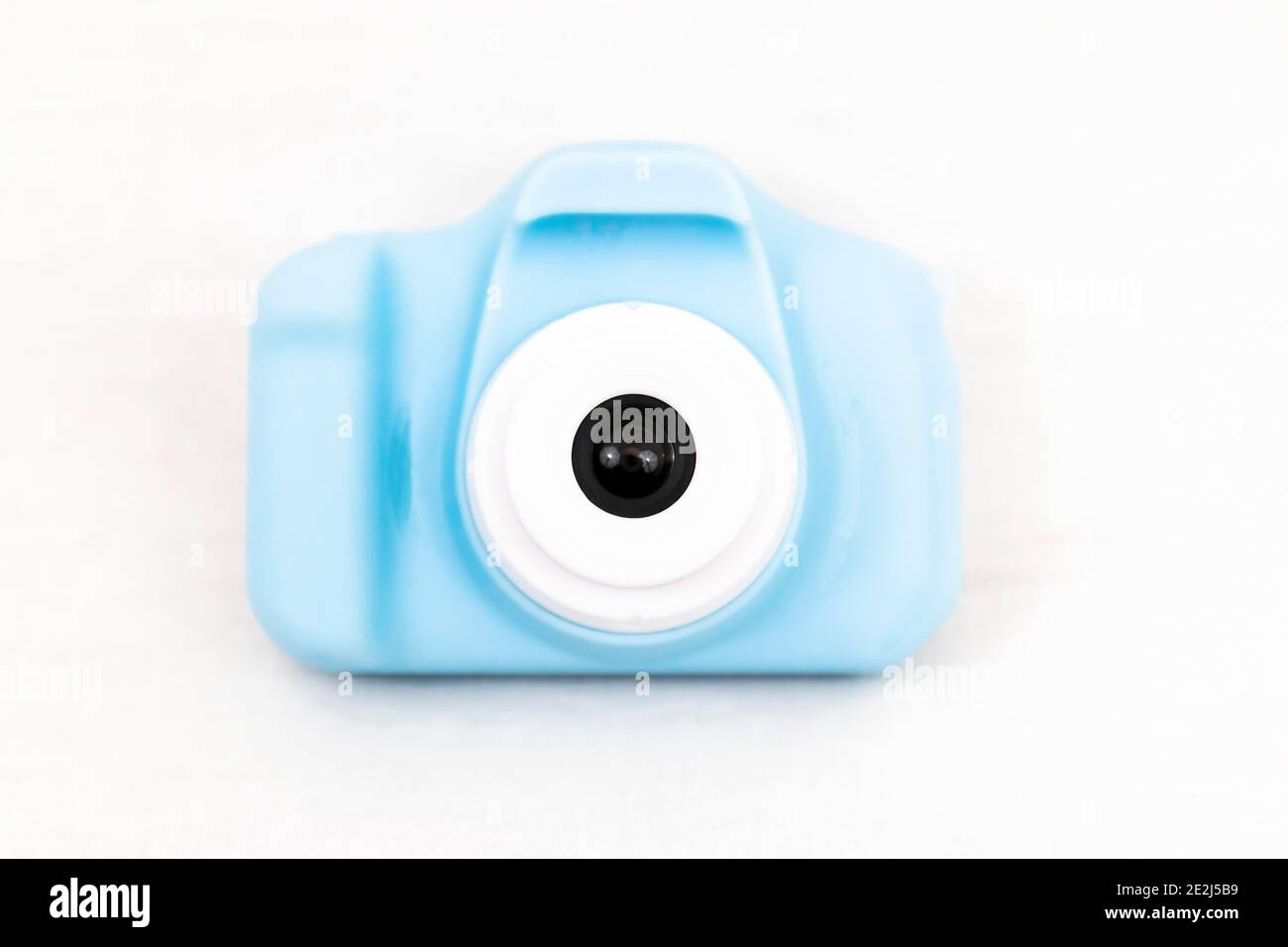 A blue toy childs digital camera with white background using selective ...