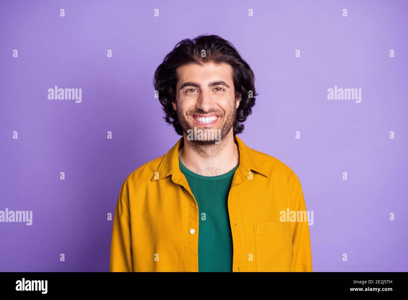 Photo of young smiling cheerful handsome male guy man look in camera ...
