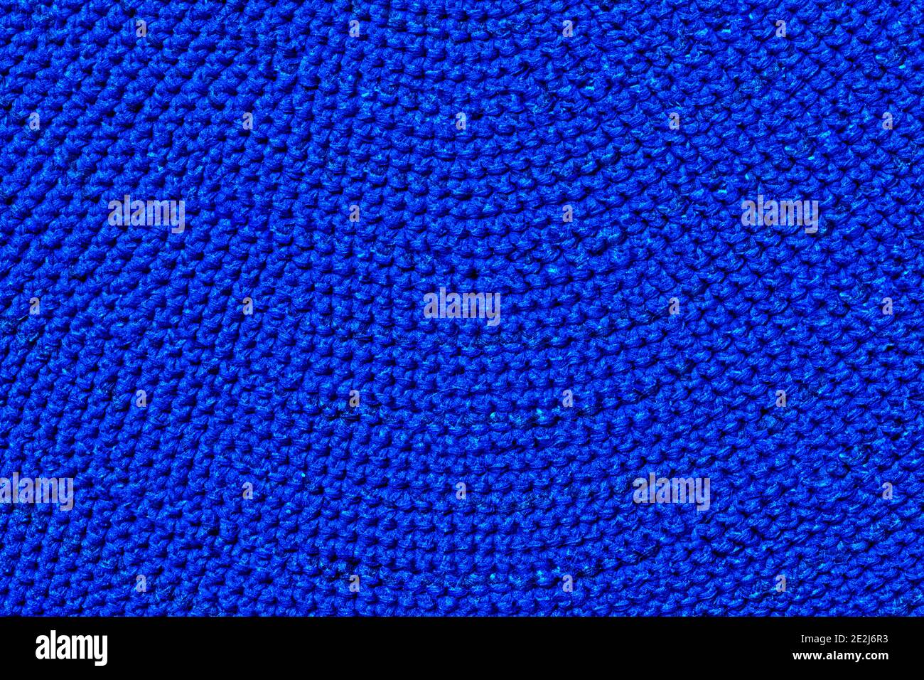 Large wool knitting of blue color. Solid surface Stock Photo - Alamy