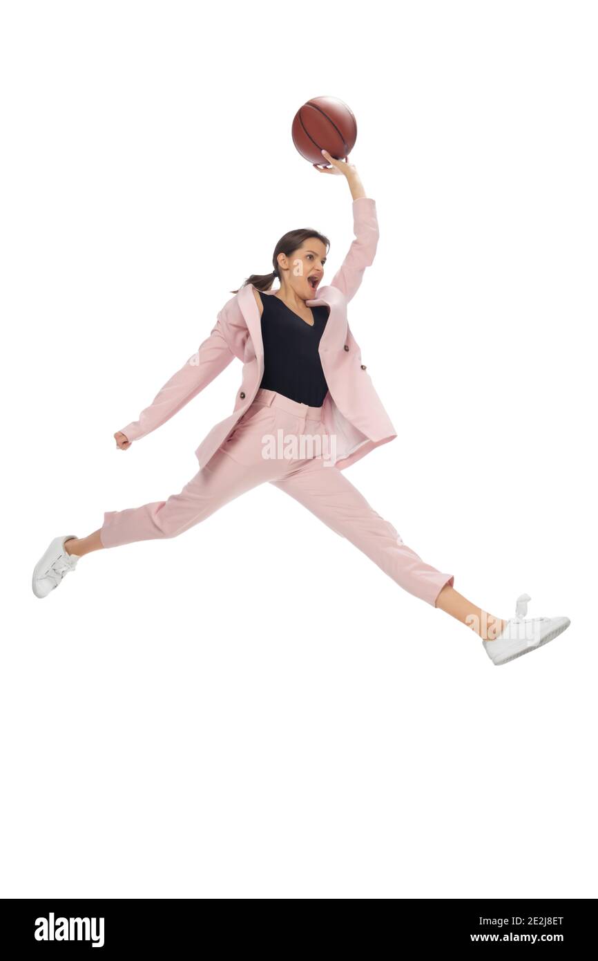 Basketball. Happy young woman dancing in casual clothes or suit ...