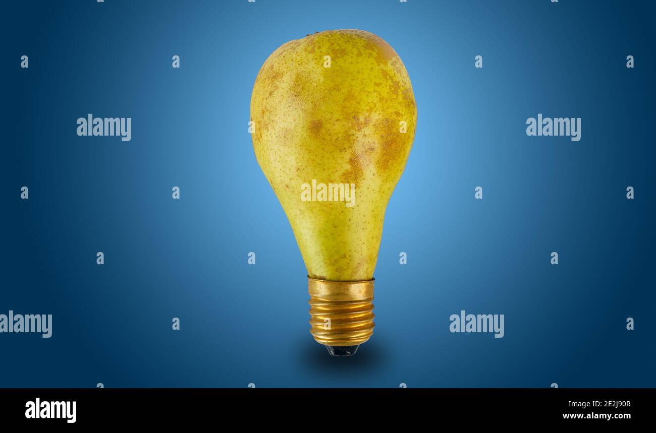 Pear in the form of an electric light bulb on a blue background Stock ...