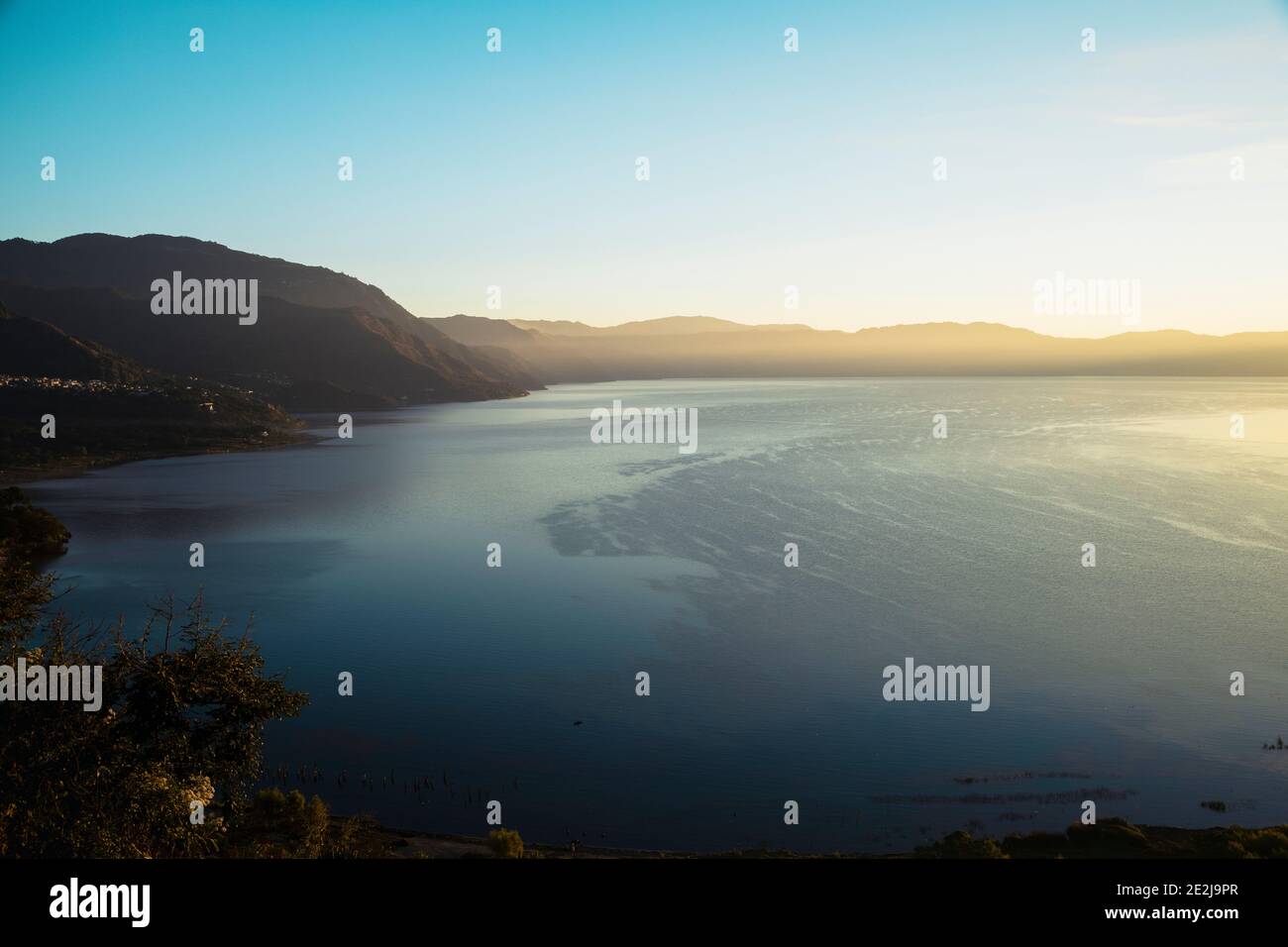 Sunrise at Lake Atitlán surrounded by mountains - sunrise landscape at ...