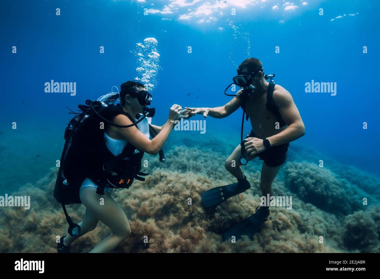 August 20, 2020. Anapa, Russia. Couple of scuba divers glides ...