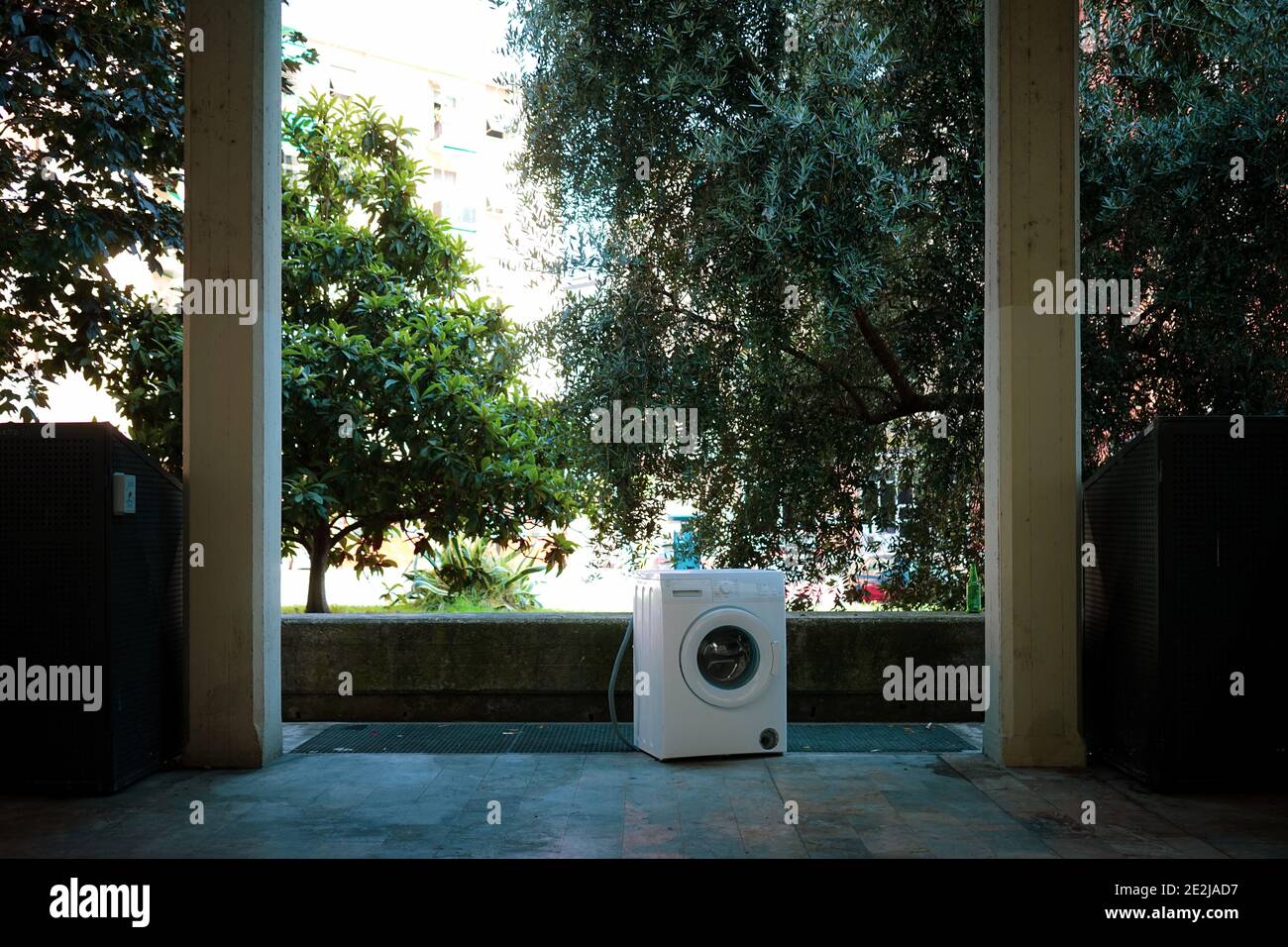 Abandoned washing machine in the street of a city Stock Photo - Alamy