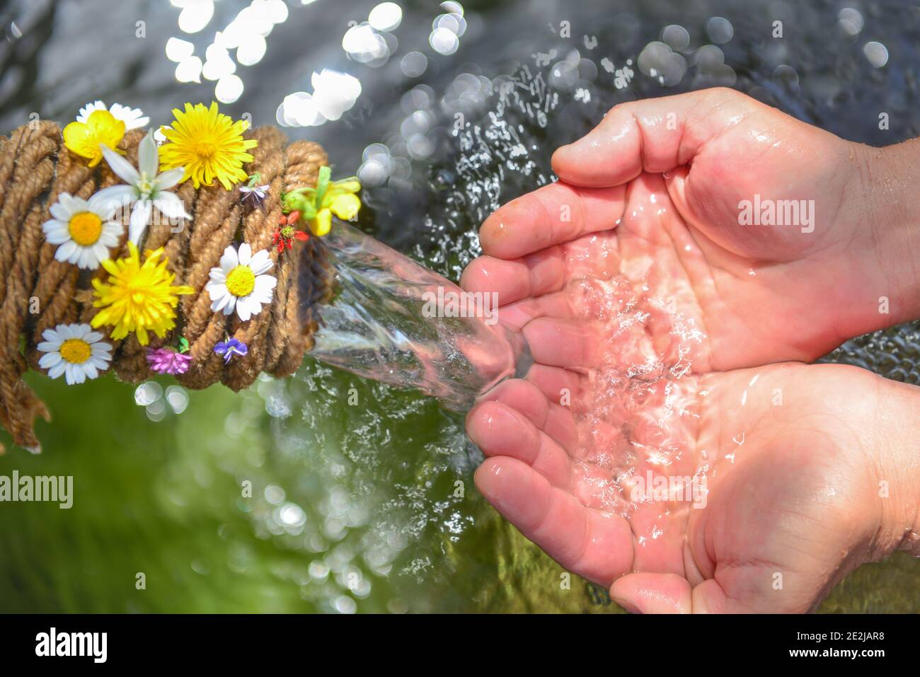 Natural and healthy drinking water from the source Stock Photo - Alamy