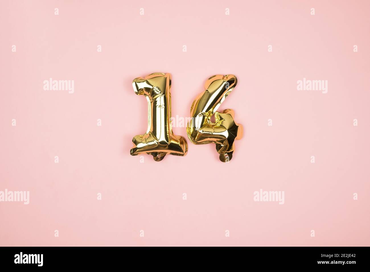 Gold foil balloons numeral 14 on pink background. Happy Valentines Day ...