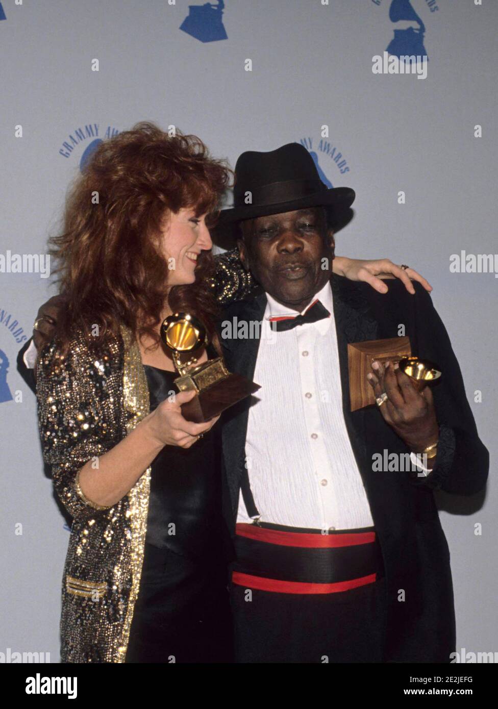 John Lee Hooker and Bonnie Raitt at the 32nd Annual Grammy Awards ...