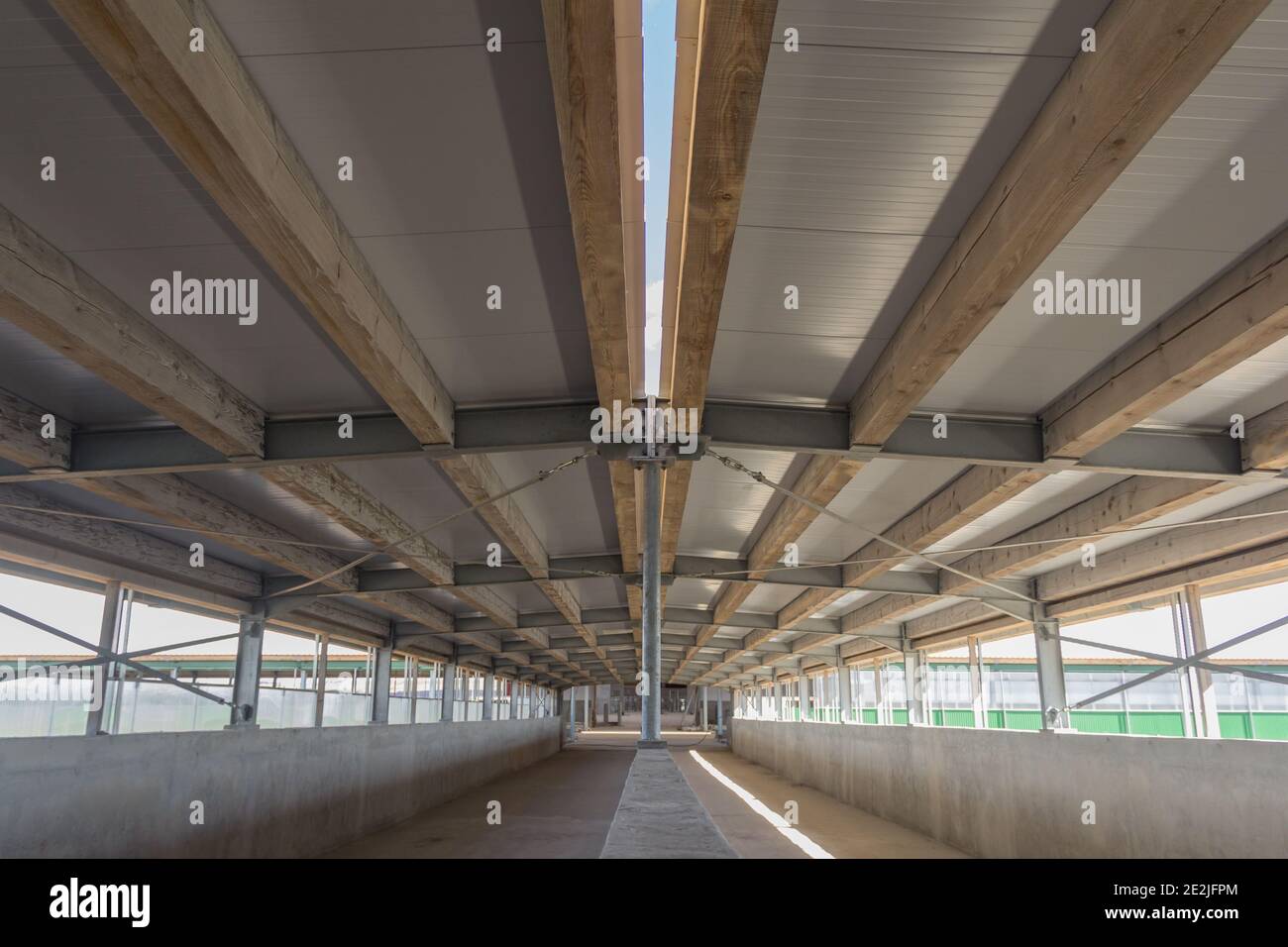 Close-up view of the connection of metal and wooden beams. Steel roof ...