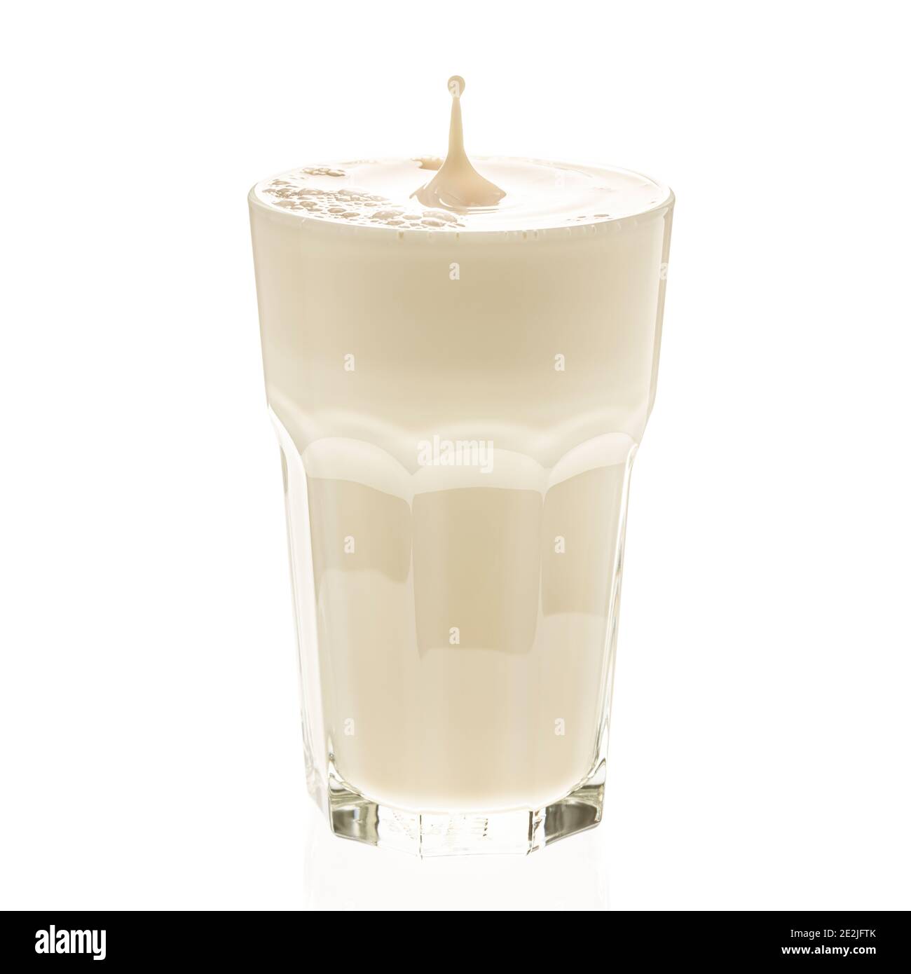 Glass of milk with splash Stock Photo - Alamy