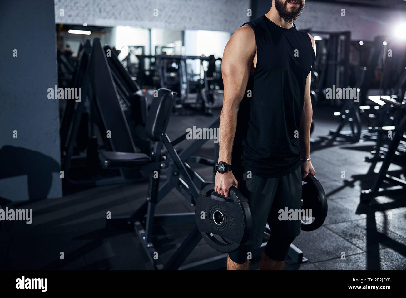 Weight disk man gym hi-res stock photography and images - Alamy