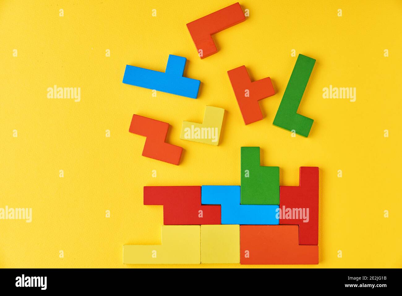 Different wooden blocks on a yellow background. Concept of logical ...