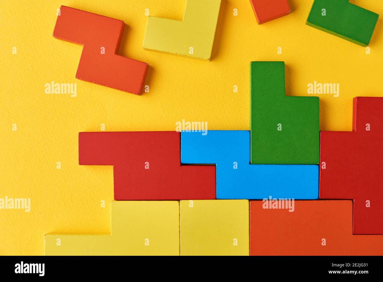 Different wooden blocks on a yellow background. Concept of logical ...