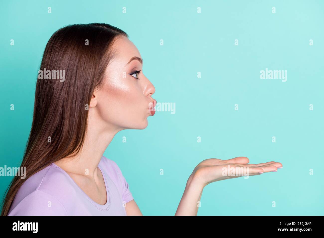 Side profile photo of girl sending air kiss with plump pouted lips ...
